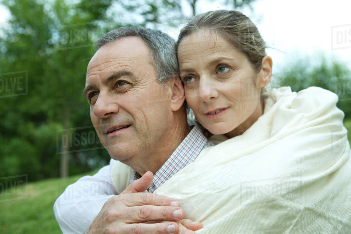 Mature couple embracing, portrait - Royalty-free Stock Photo | Dissolve