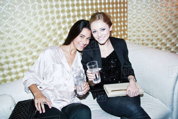 Friends enjoying night out together at night club, portrait - Royalty ...