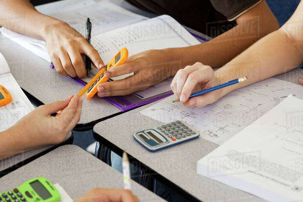 Students studying math together - Stock Photo - Dissolve