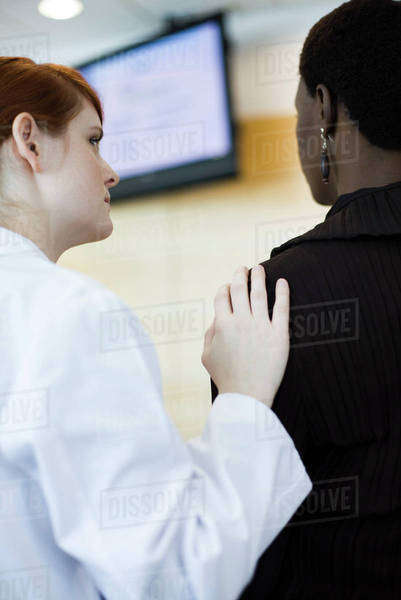 Female healthcare worker showing concern for patient - Royalty-free ...