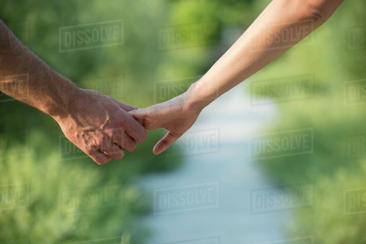 Couple hesitantly hold hands, close-up - Royalty-free Stock Photo ...