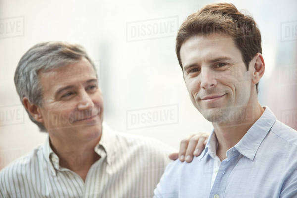 Adult son and father, portrait - Stock Photo - Dissolve