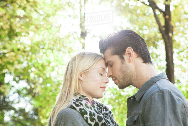 Couple nuzzling with eyes closed outdoors - Royalty-free Stock Photo ...