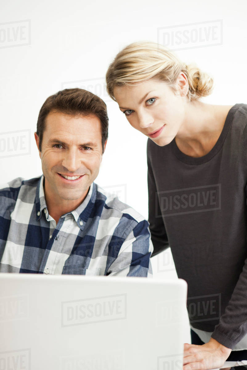 Colleagues collaborating on work project - Stock Photo - Dissolve