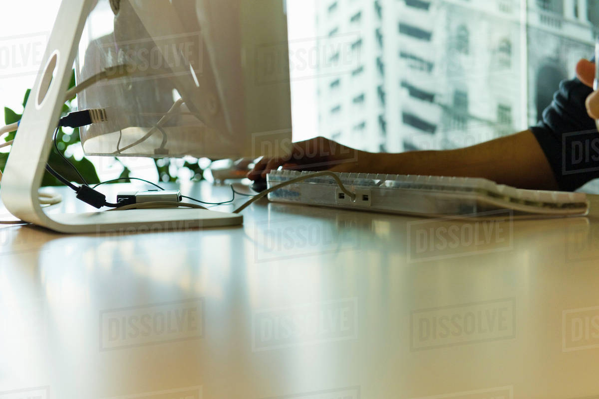 Person using desktop computer - Royalty-free Stock Photo | Dissolve