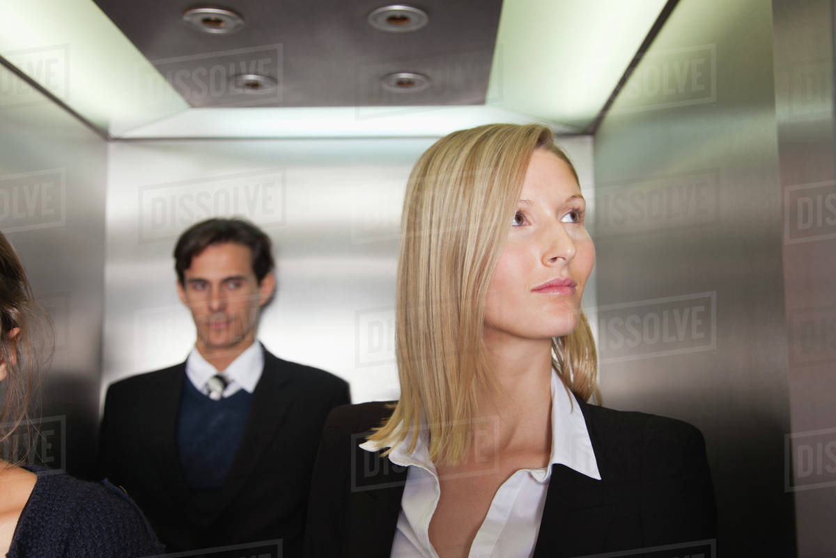 Businesswoman on elevator - Royalty-free Stock Photo | Dissolve