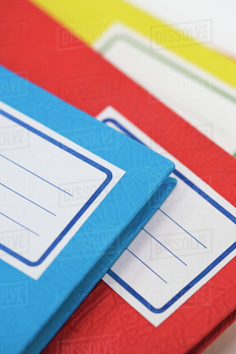 Pile of school notebooks with blank labels - Royalty-free Stock Photo ...