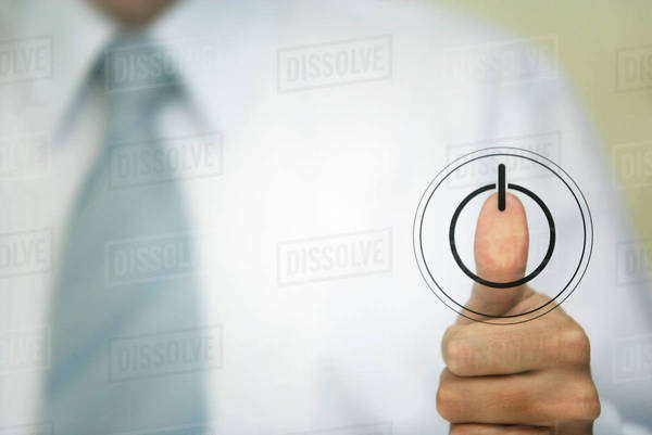 Man pressing thumb to power button - Royalty-free Stock Photo | Dissolve