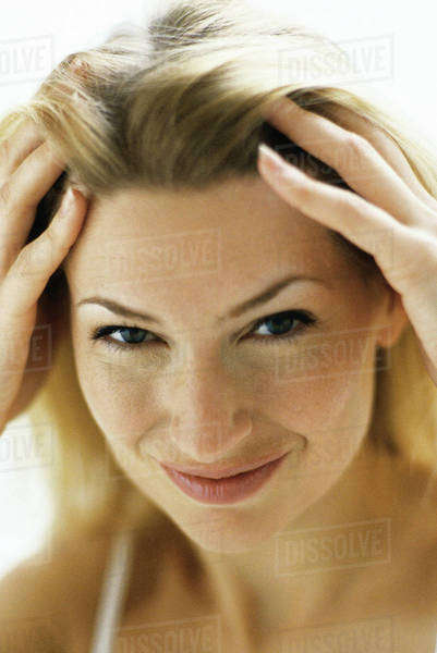 Woman running hands through hair, portrait - Royalty-free Stock Photo ...
