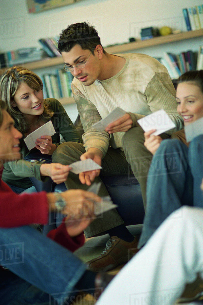 Friends looking at each other's photo collection - Royalty-free Stock ...