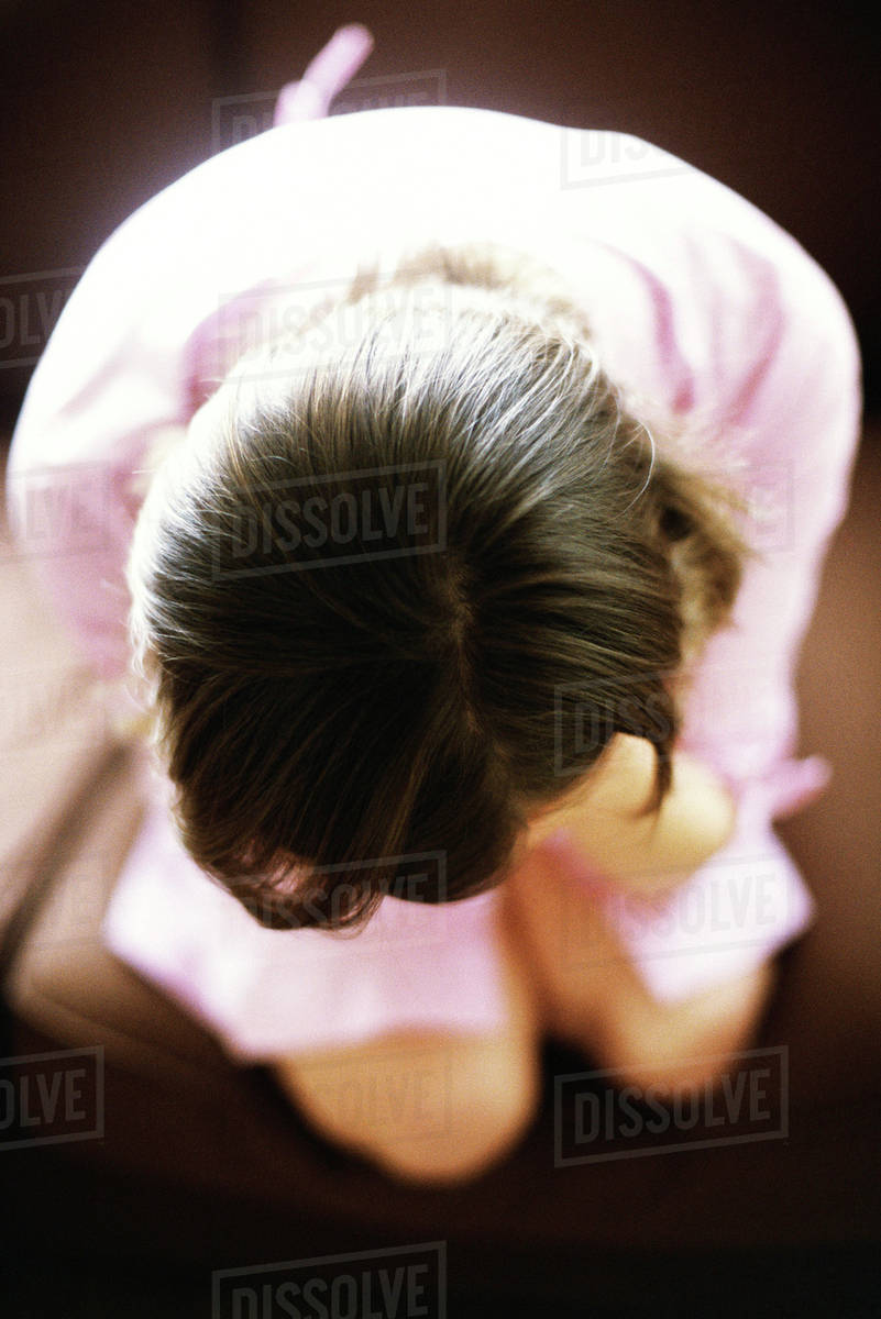 Woman sitting, high angle view - Royalty-free Stock Photo | Dissolve