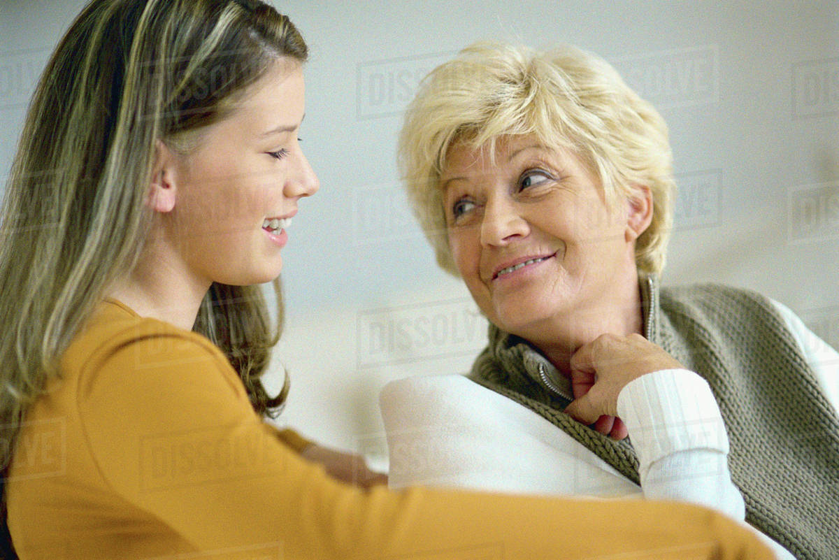 Teenage girl talking with grandmother - Royalty-free Stock Photo | Dissolve