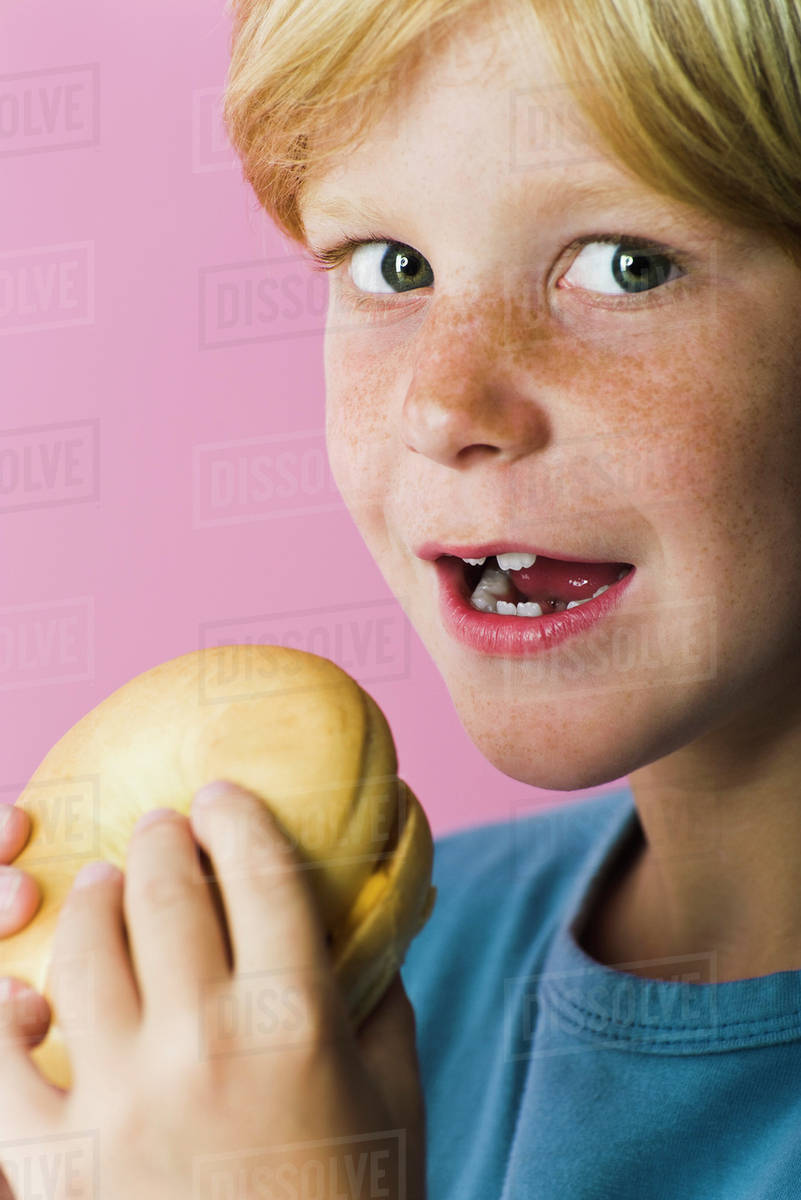 Boy with ham and cheese sandwich - Stock Photo - Dissolve