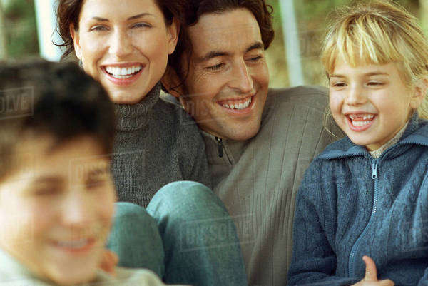 Family laughing together - Royalty-free Stock Photo | Dissolve