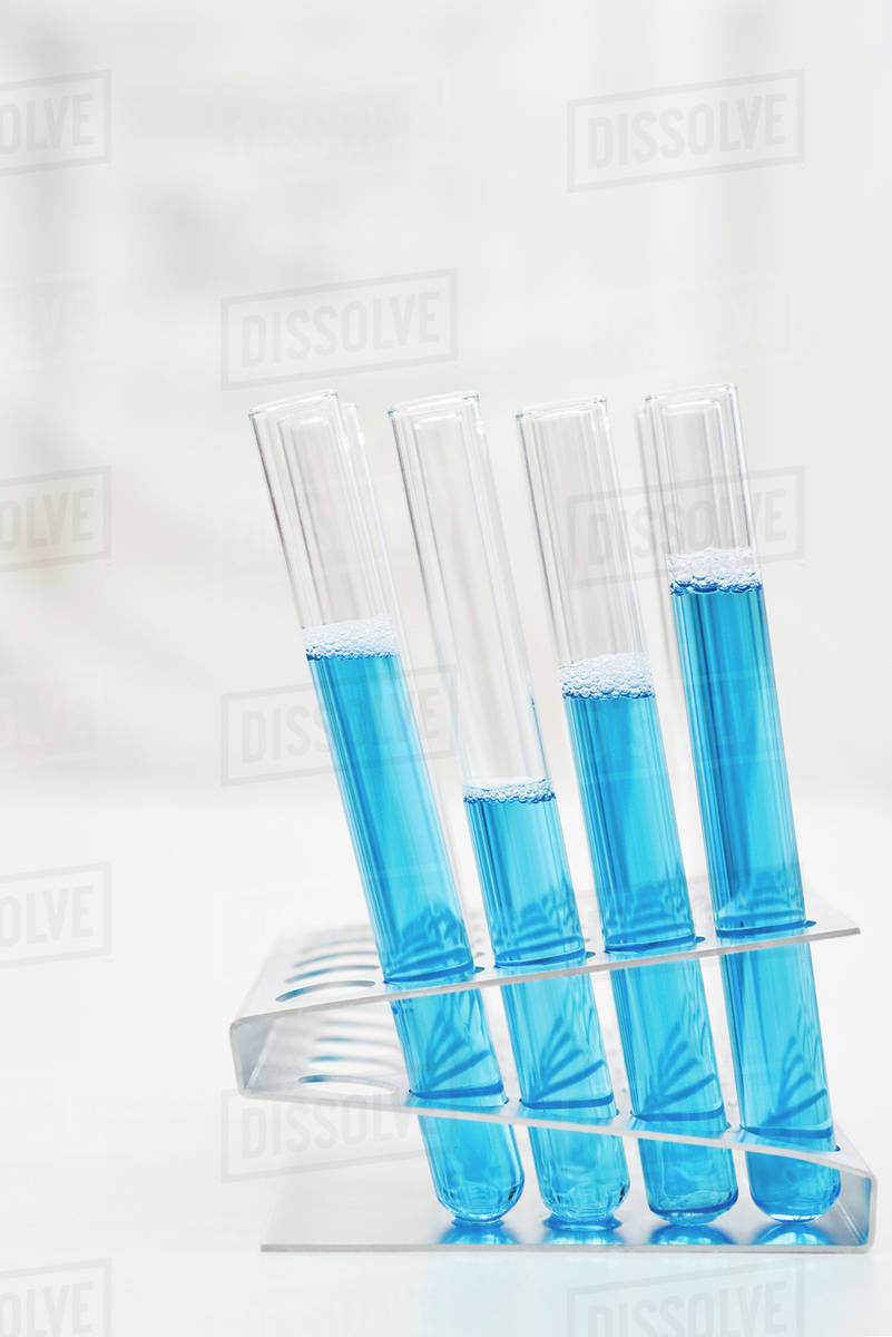 Test tubes containing blue liquid - Royalty-free Stock Photo | Dissolve