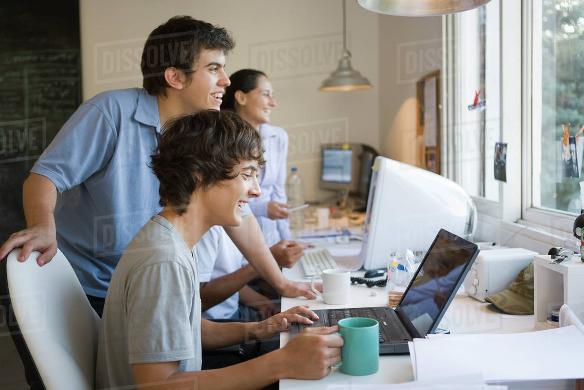 College students collaborating on project - Stock Photo - Dissolve