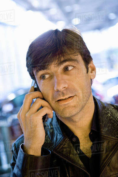 Man using cell phone - Stock Photo - Dissolve