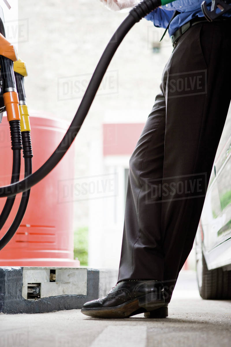 Refueling vehicle at gas station - Royalty-free Stock Photo | Dissolve