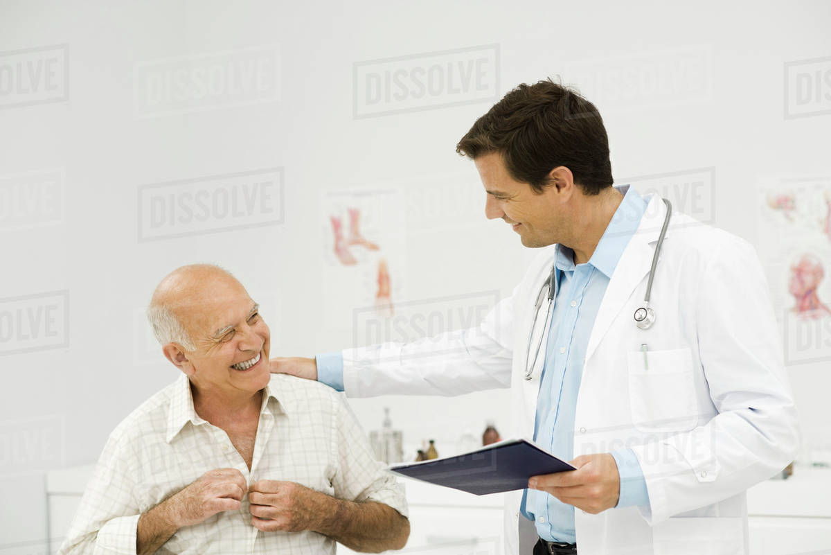 Doctor with senior patient - Stock Photo - Dissolve