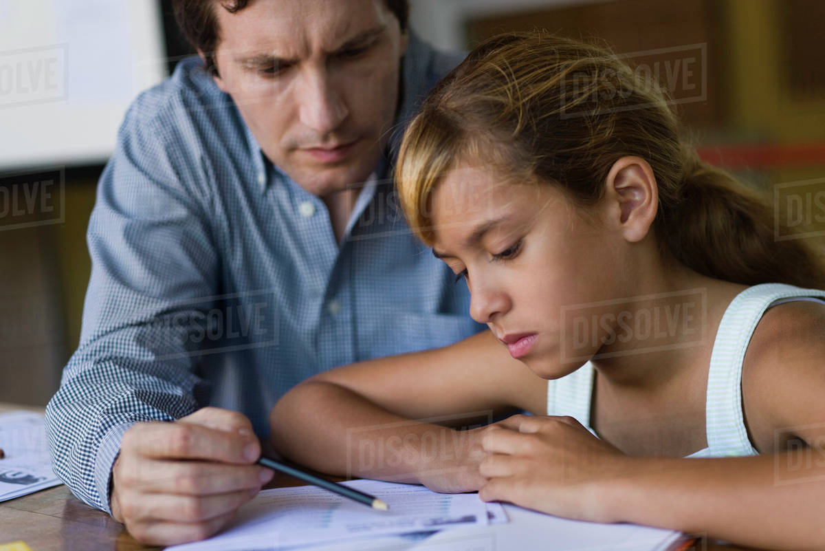 Teacher helping elementary school student in class - Royalty-free Stock ...