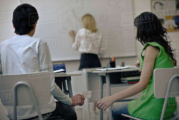 High school students passing notes in class - Royalty-free Stock Photo ...