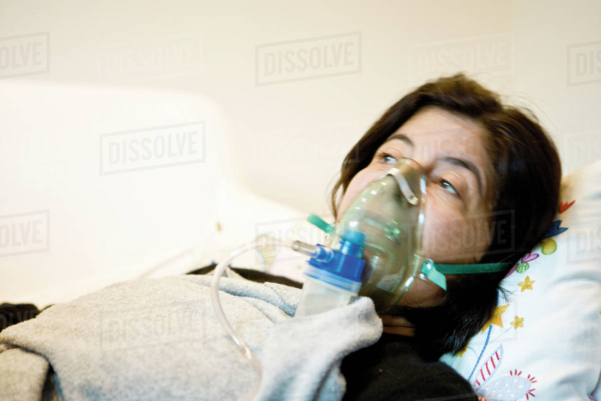 Woman receiving oxygen treatment - Royalty-free Stock Photo | Dissolve