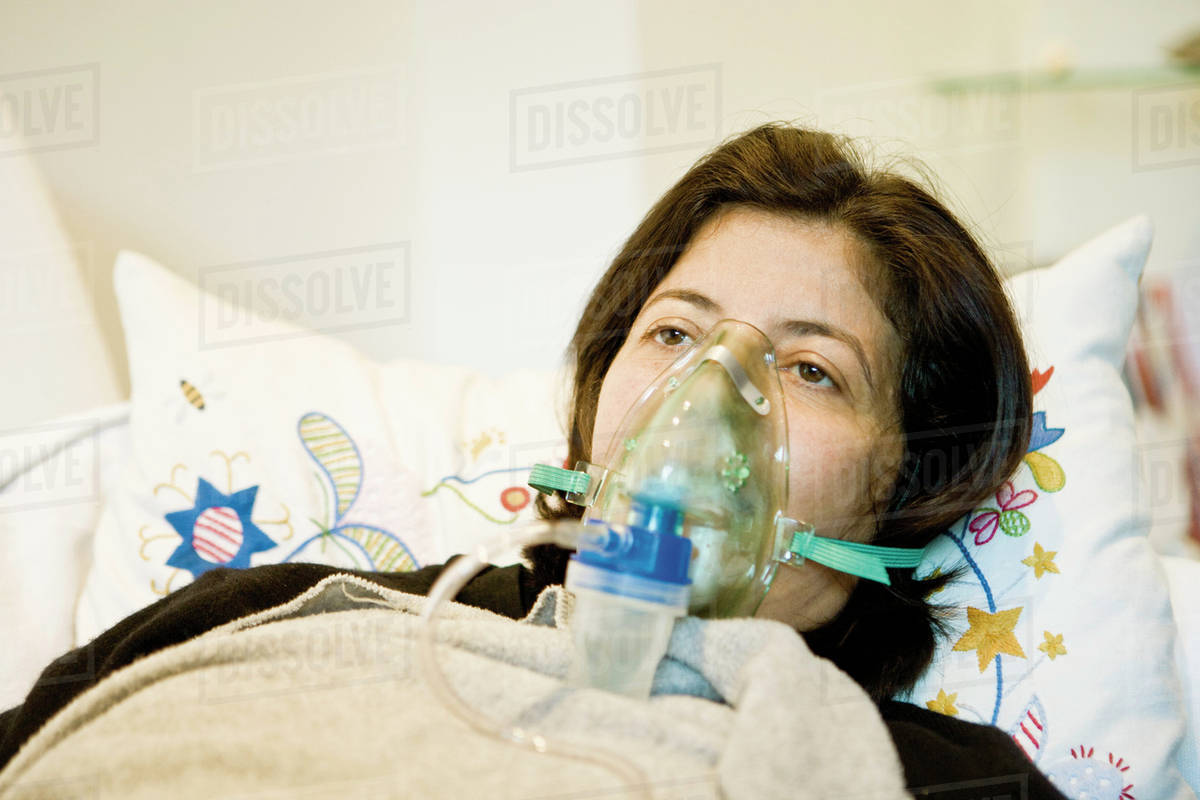 Woman receiving oxygen treatment - Royalty-free Stock Photo | Dissolve