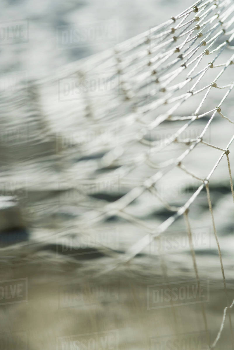 Fishing net over water, close-up - Royalty-free Stock Photo | Dissolve