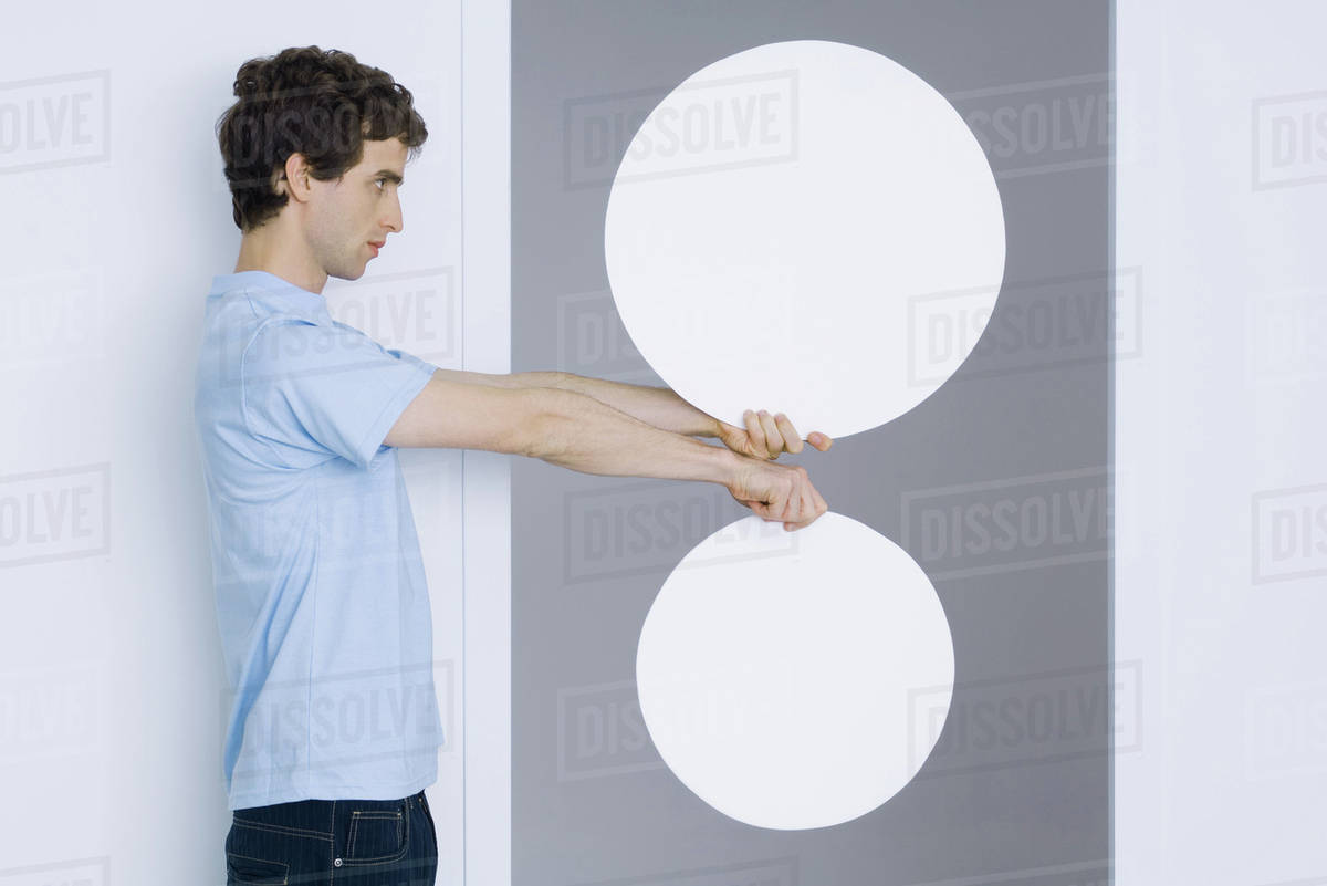 Man holding out two blank signs - Royalty-free Stock Photo | Dissolve