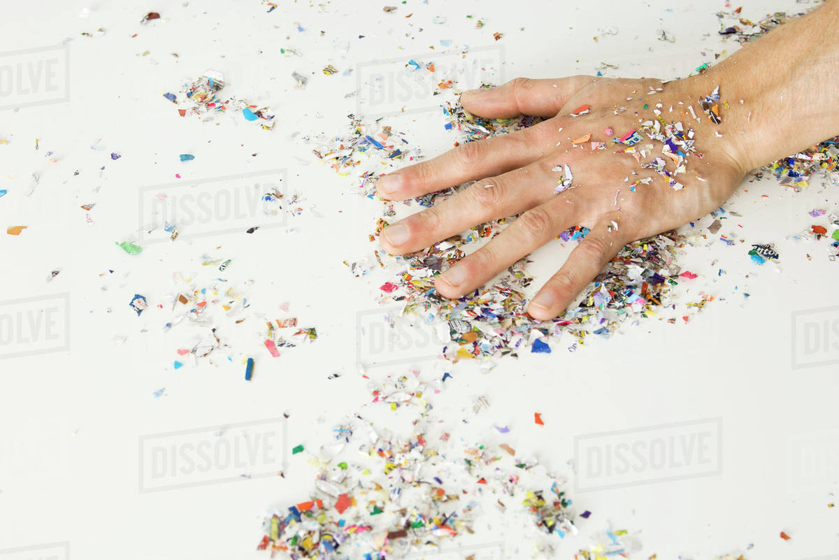 Hand covered with confetti - Royalty-free Stock Photo | Dissolve