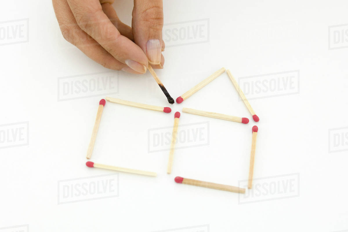 Hand arranging matches, holding one burnt match - Royalty-free Stock ...