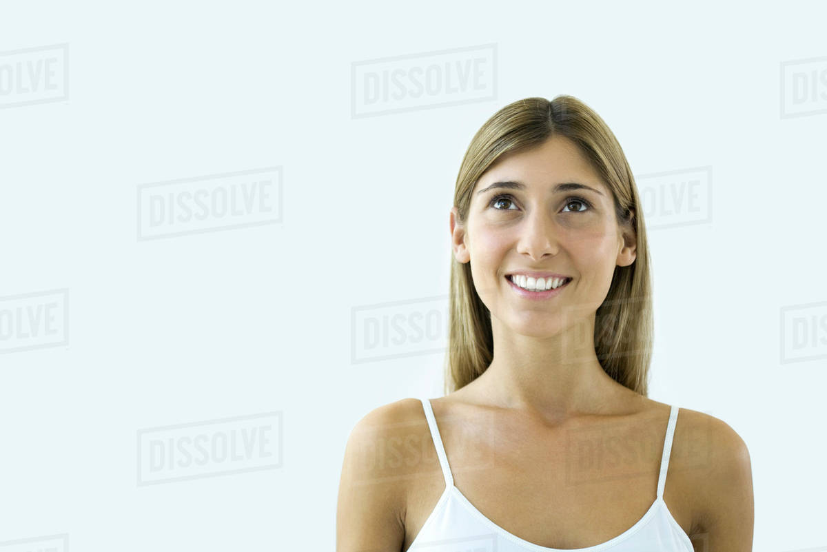 Young woman looking up and smiling, portrait - Royalty-free Stock Photo ...