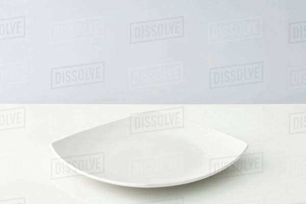Curved plate, close-up - Royalty-free Stock Photo | Dissolve
