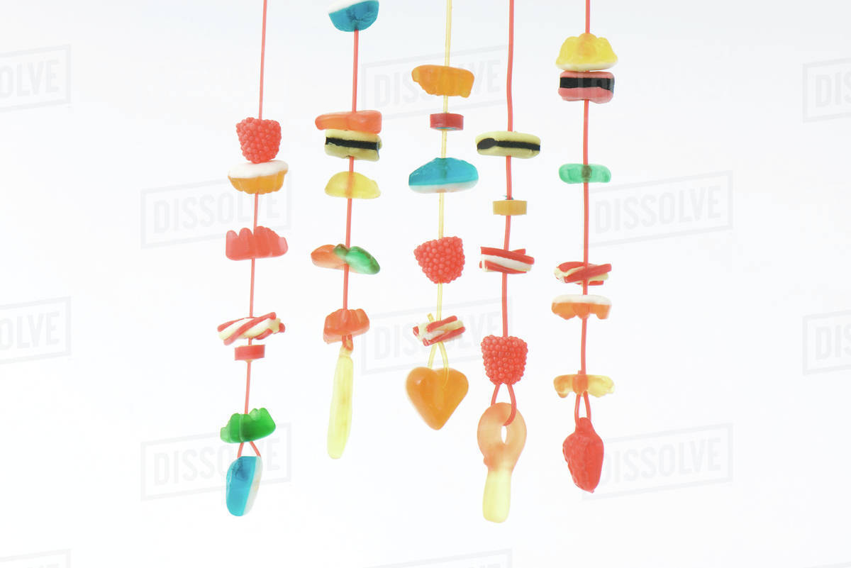 Strings of colorful candy - Stock Photo - Dissolve