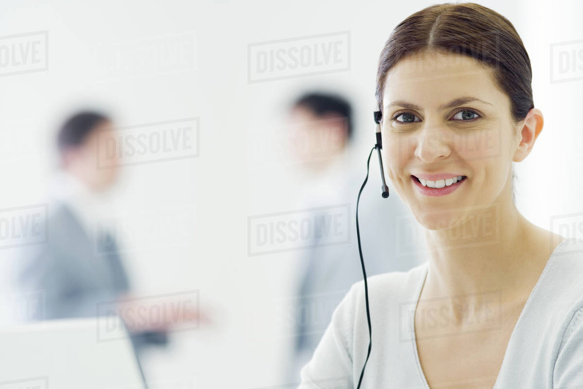 Female telemarketer smiling at camera, portrait - Royalty-free Stock ...