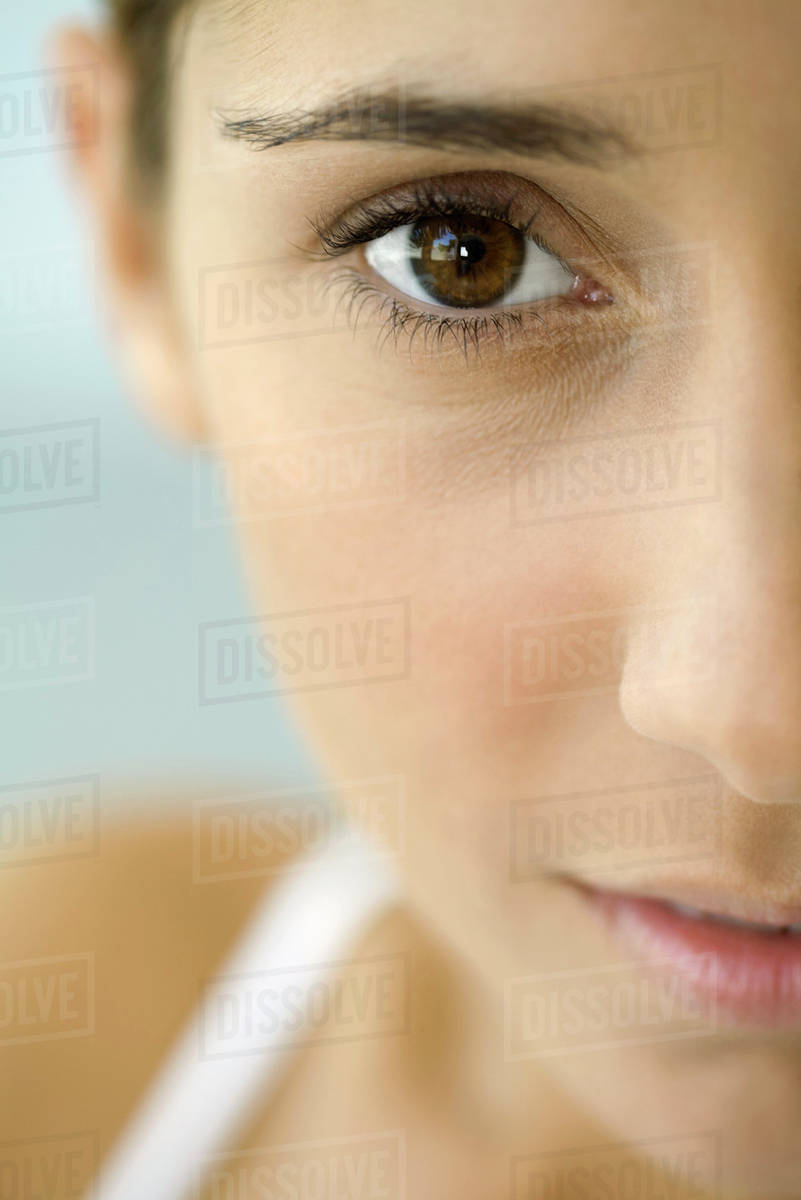 Woman looking at camera, extreme close-up, cropped - Royalty-free Stock ...