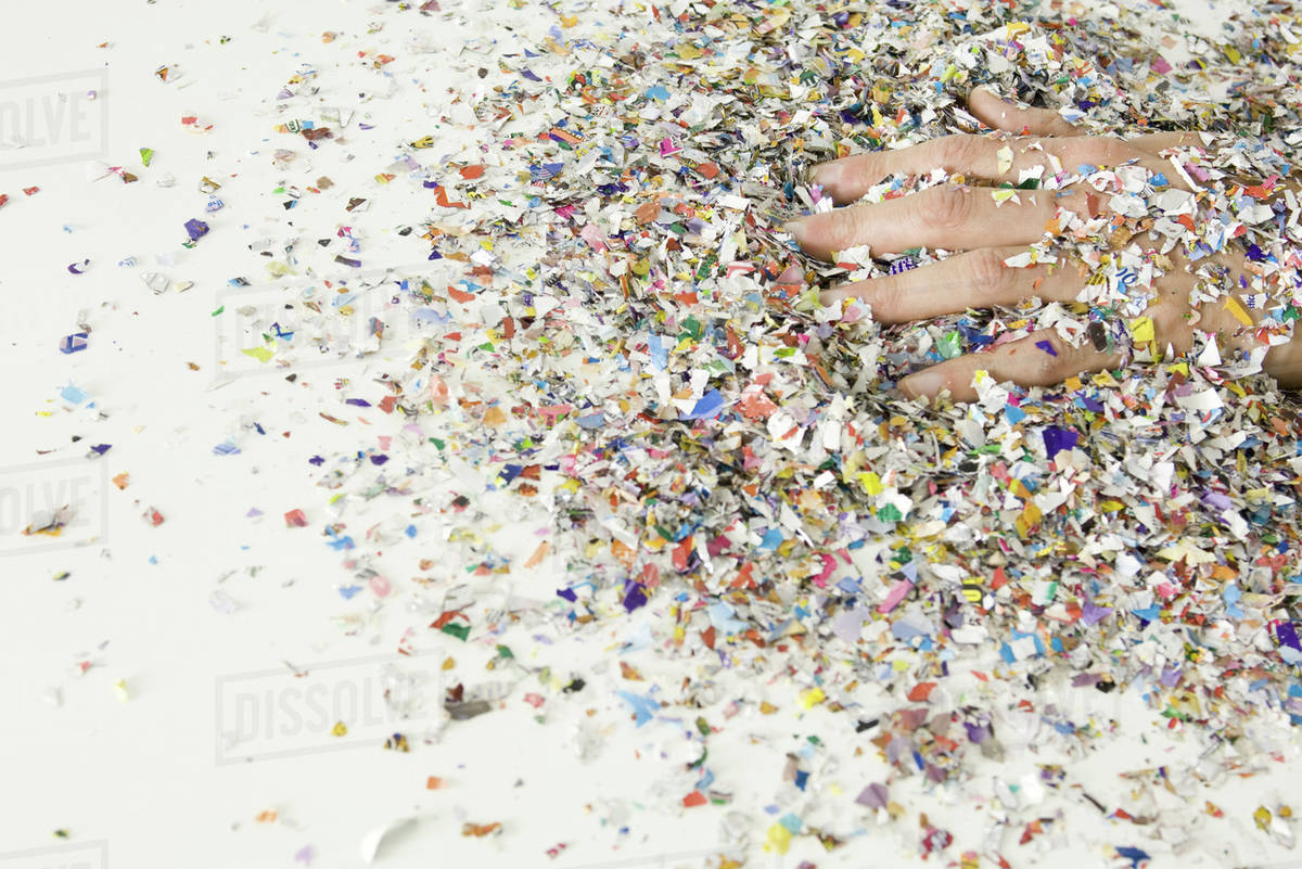 Hand covered in confetti - Royalty-free Stock Photo | Dissolve