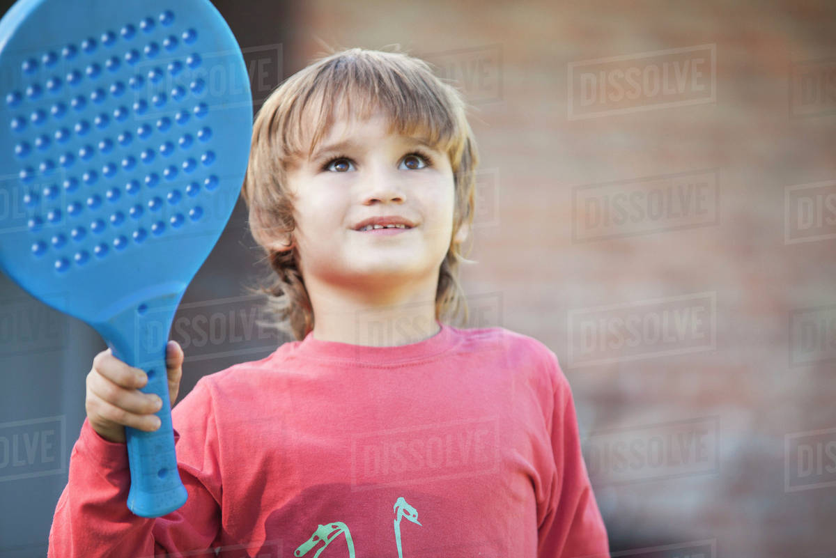Boy holding racket - Royalty-free Stock Photo | Dissolve