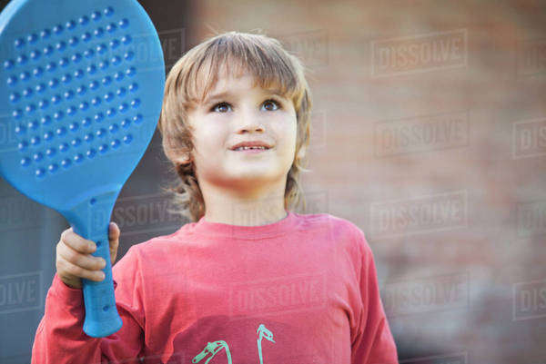 Boy holding racket - Royalty-free Stock Photo | Dissolve