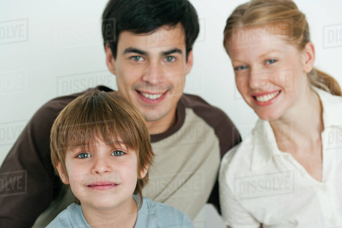 Boy with parents, focus on foreground - Royalty-free Stock Photo | Dissolve