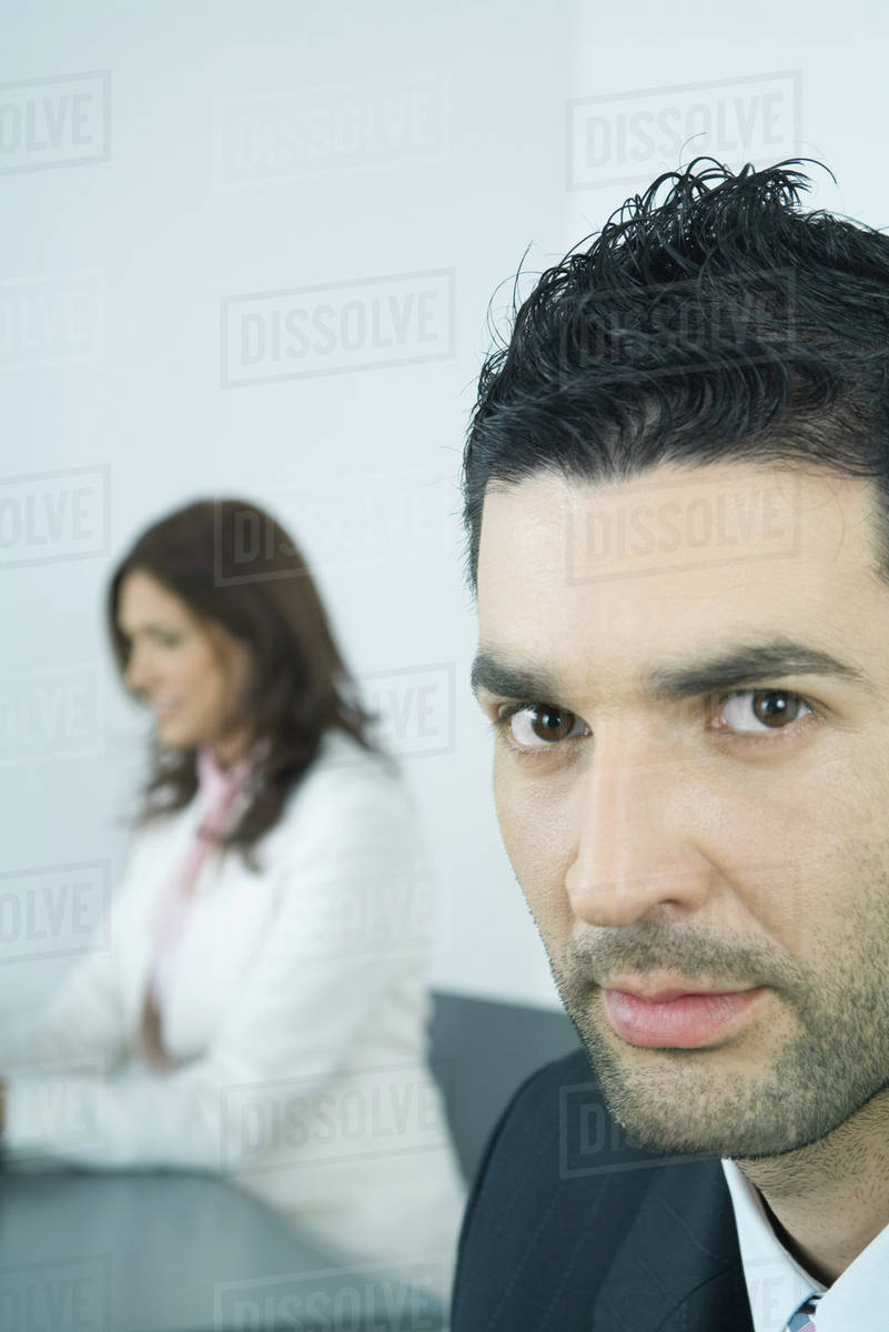 Businessman, glaring at camera - Royalty-free Stock Photo | Dissolve