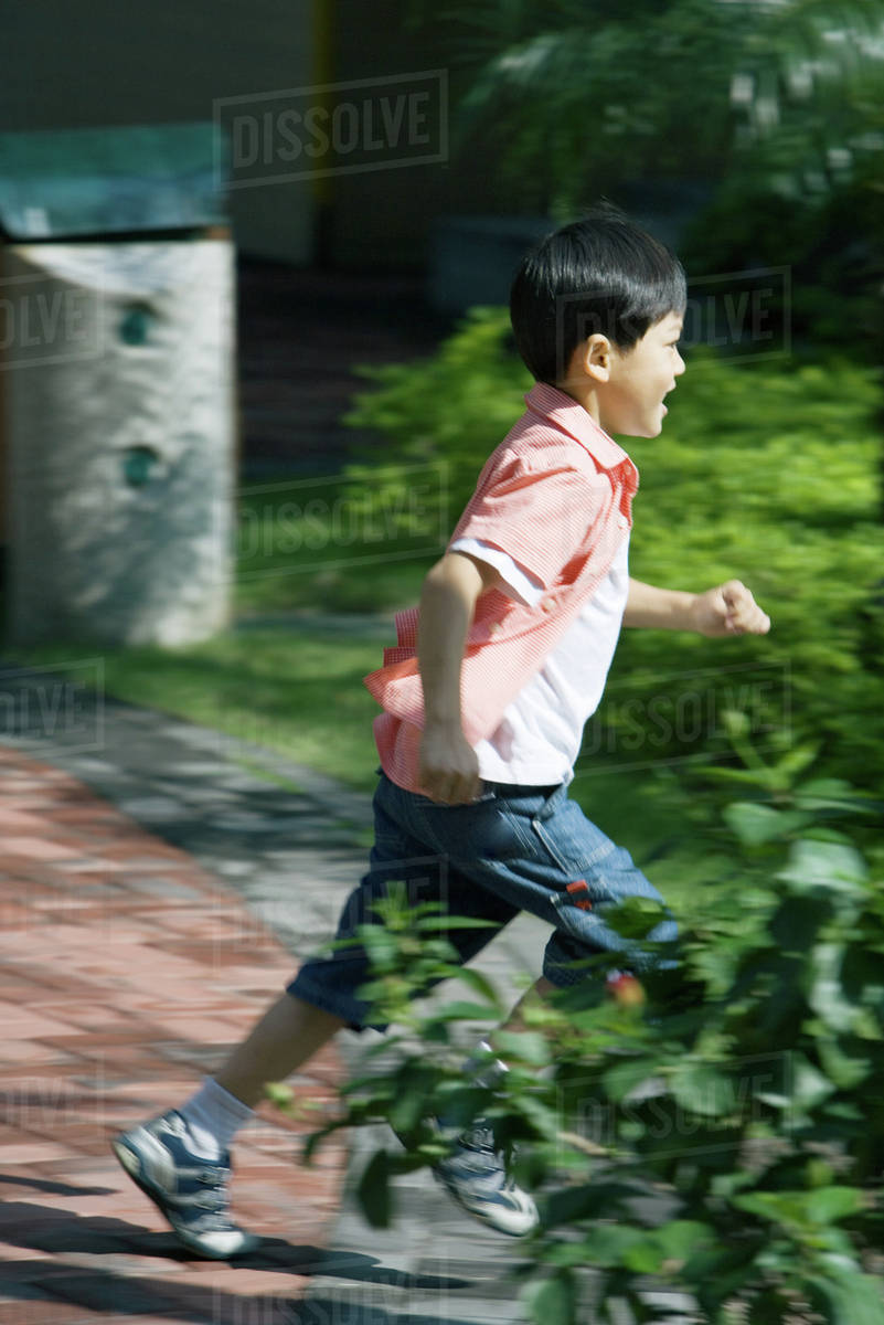 Boy running - Stock Photo - Dissolve