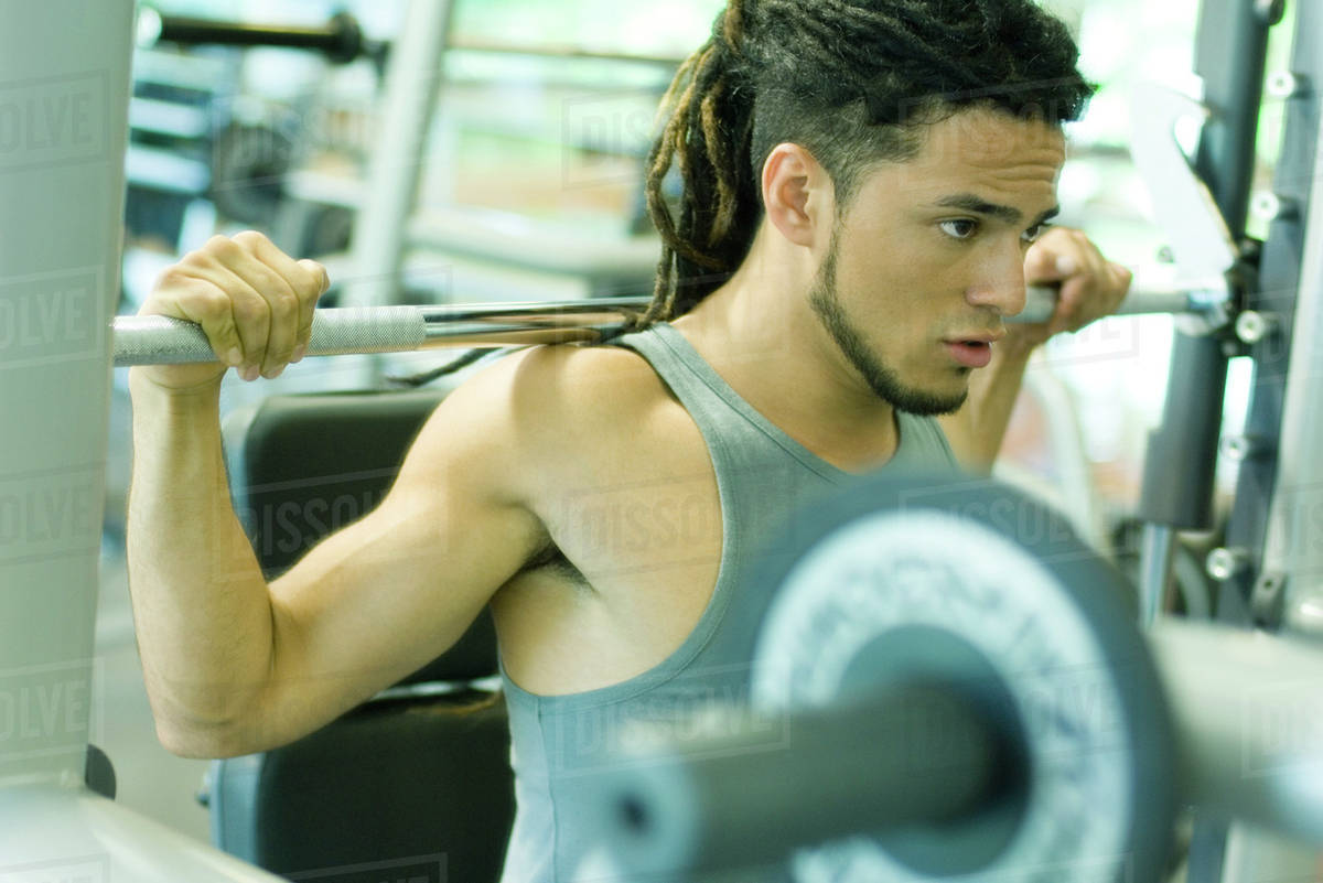 Man lifting barbell - Royalty-free Stock Photo | Dissolve