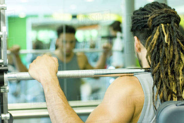 Man lifting barbell - Royalty-free Stock Photo | Dissolve