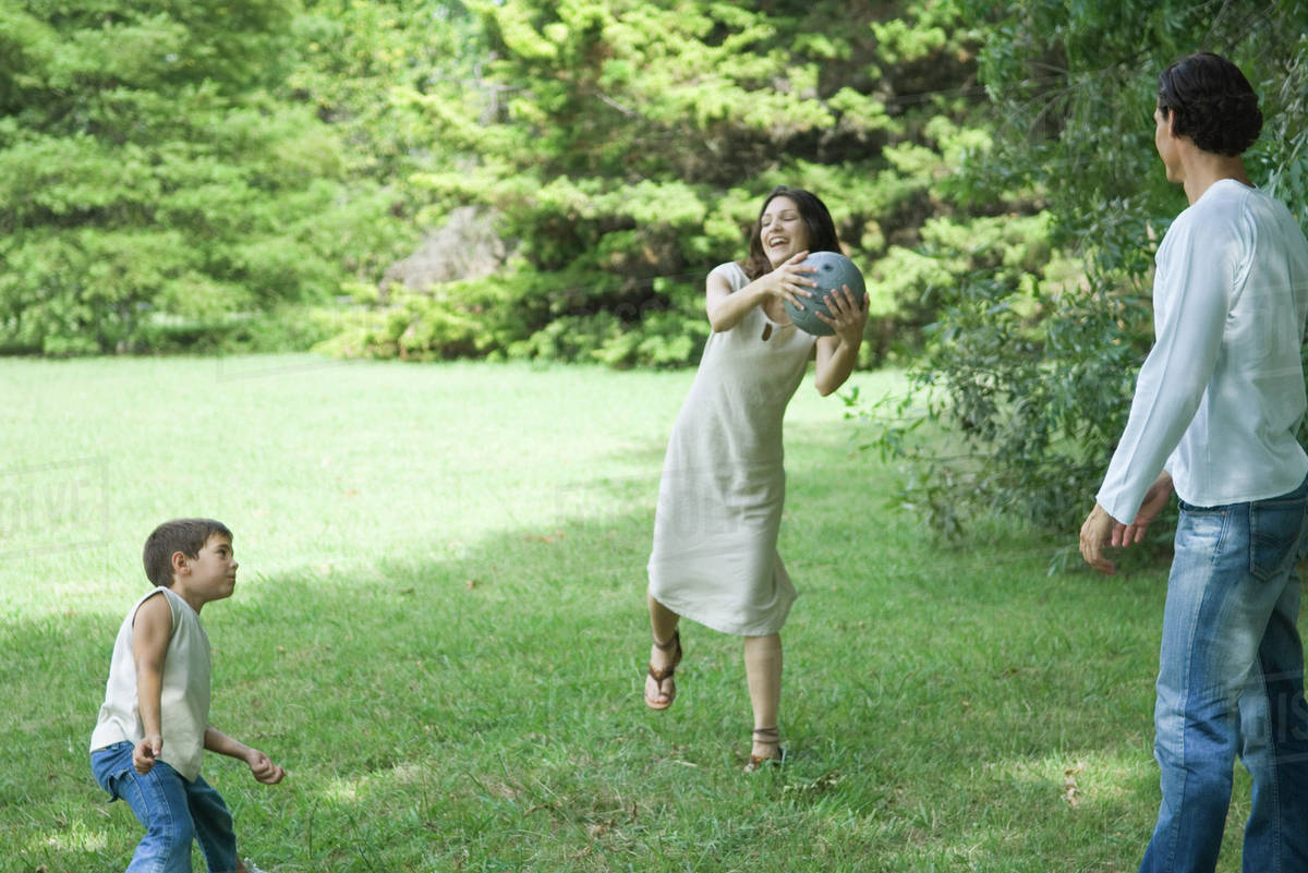 Family playing ball - Stock Photo - Dissolve