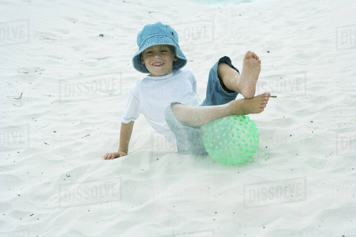 Child playing in sand - Royalty-free Stock Photo | Dissolve