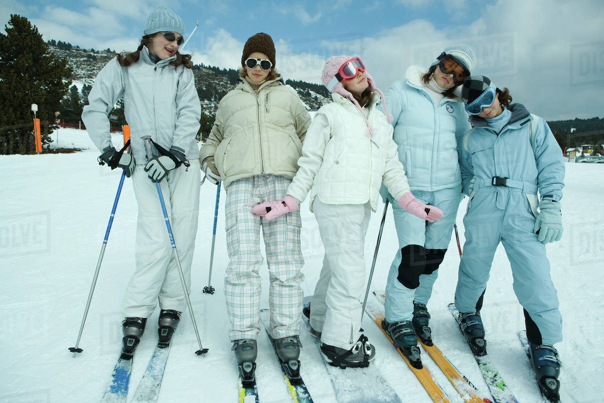 Group of young skiers, full length, portrait - Stock Photo - Dissolve