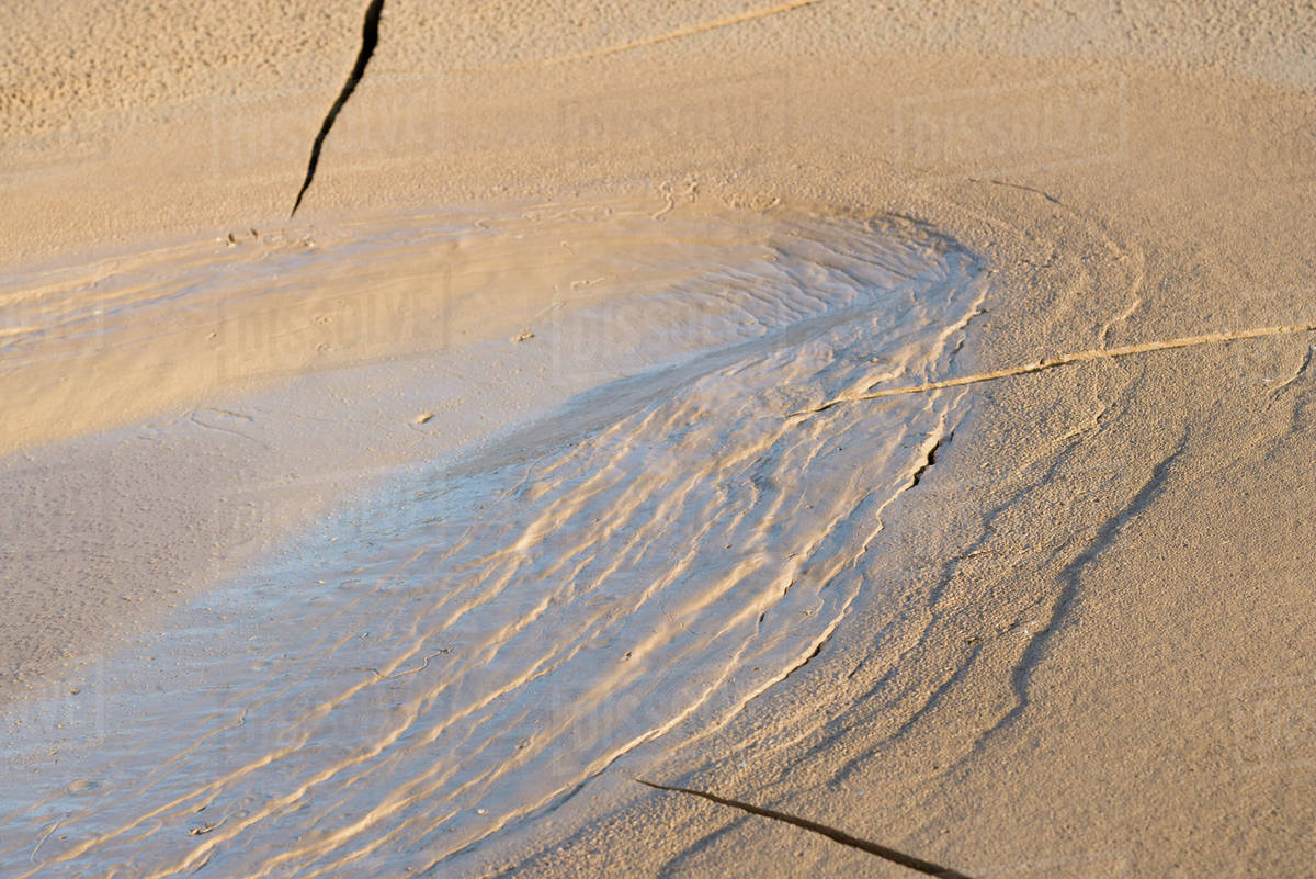 Drying puddle in cracking soil, full frame - Royalty-free Stock Photo ...