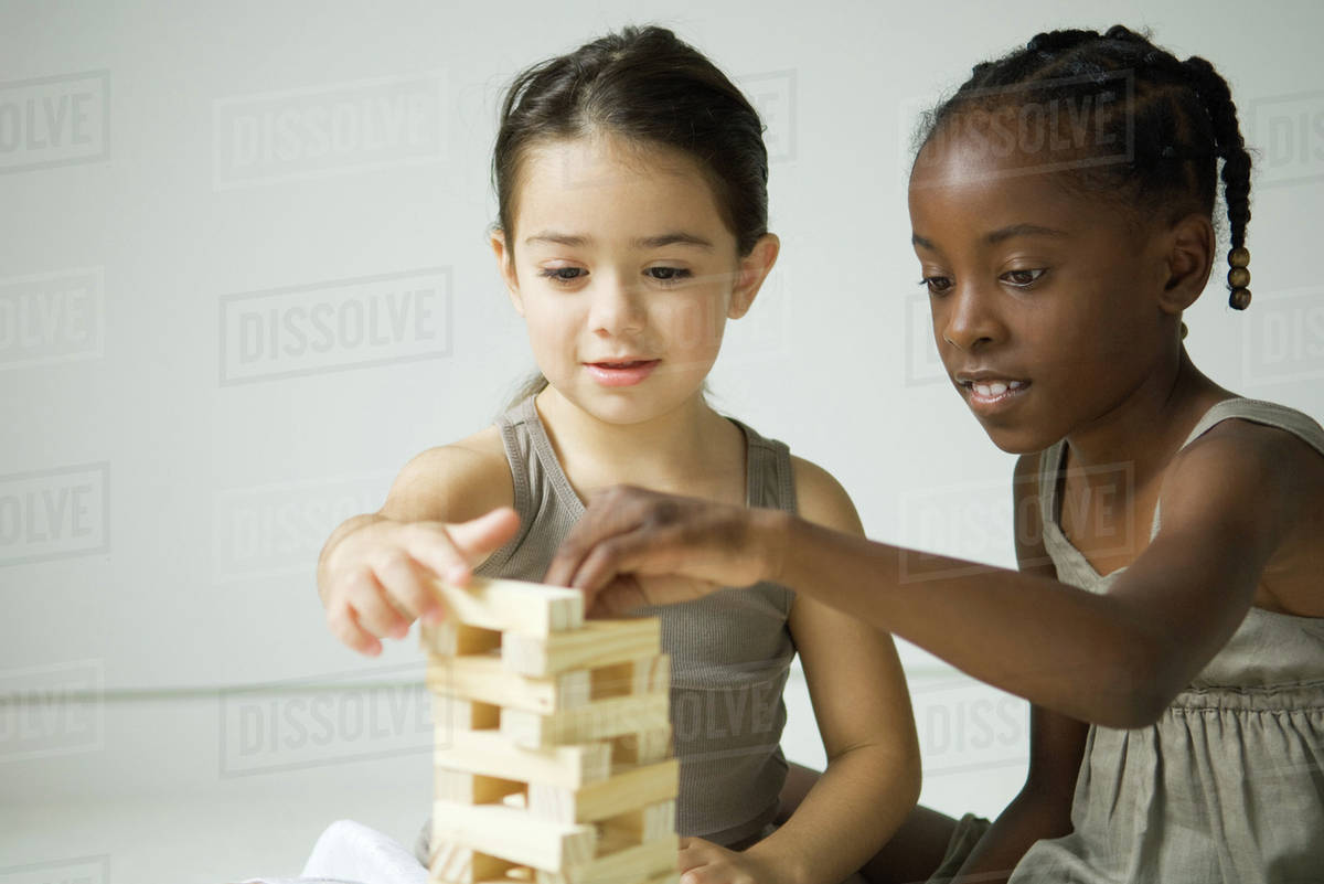 Two girls building tower with blocks together - Royalty-free Stock ...