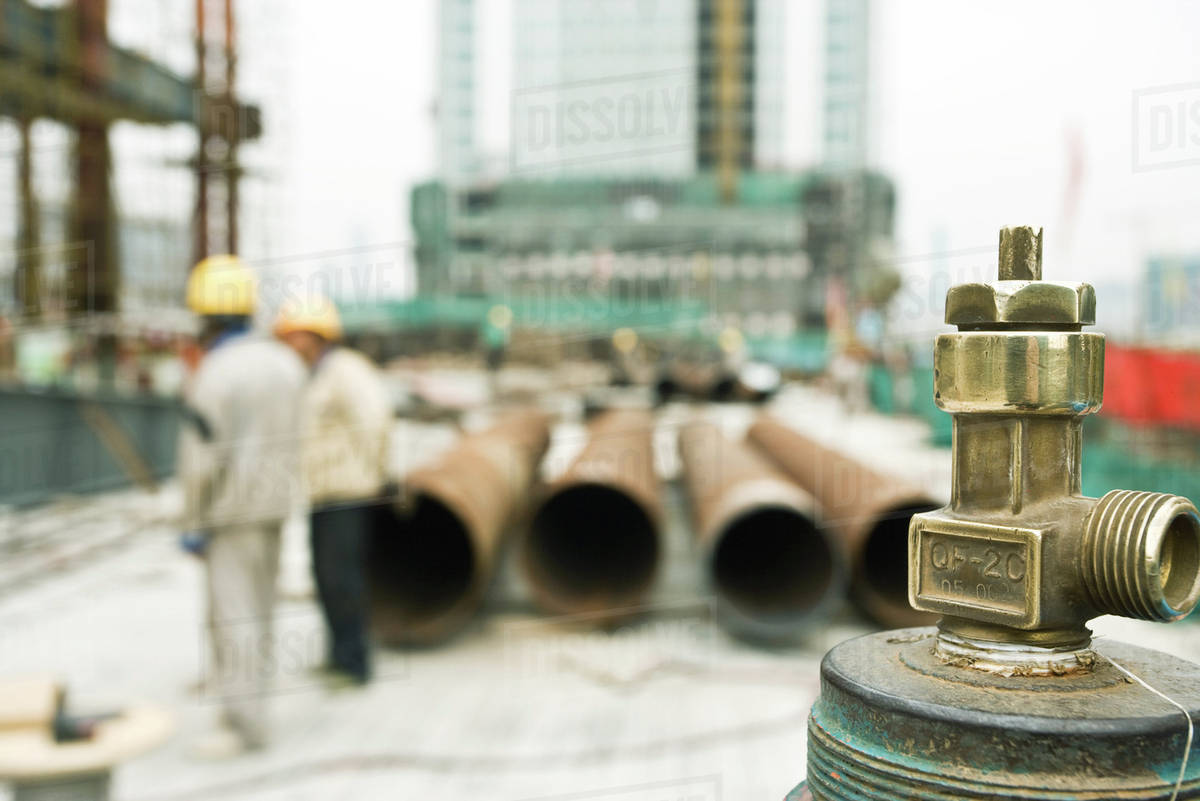 Construction site, focus on spigot in foreground - Royalty-free Stock ...